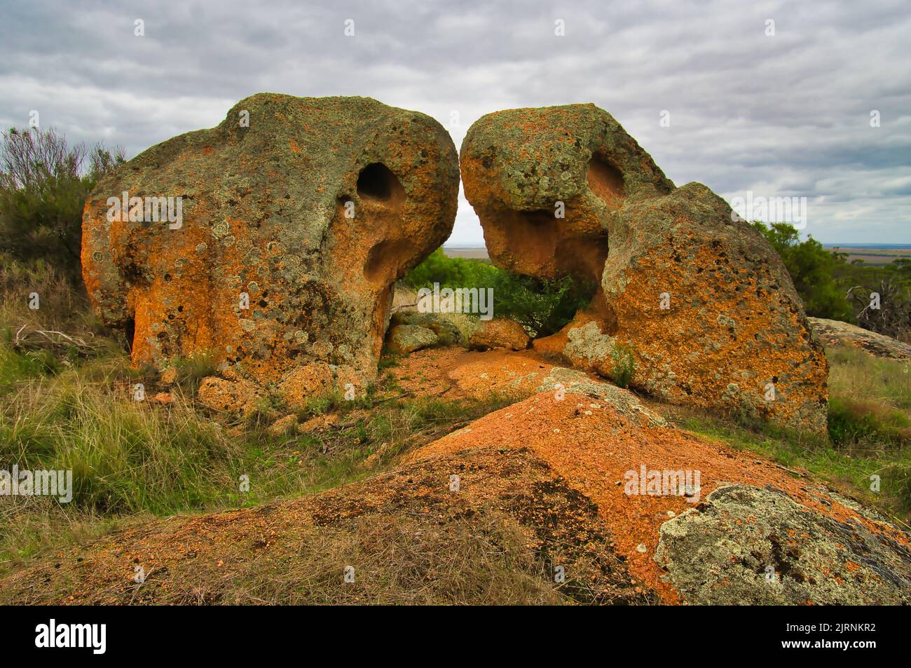Striking red granite formations, resembling giant animal heads, on ...