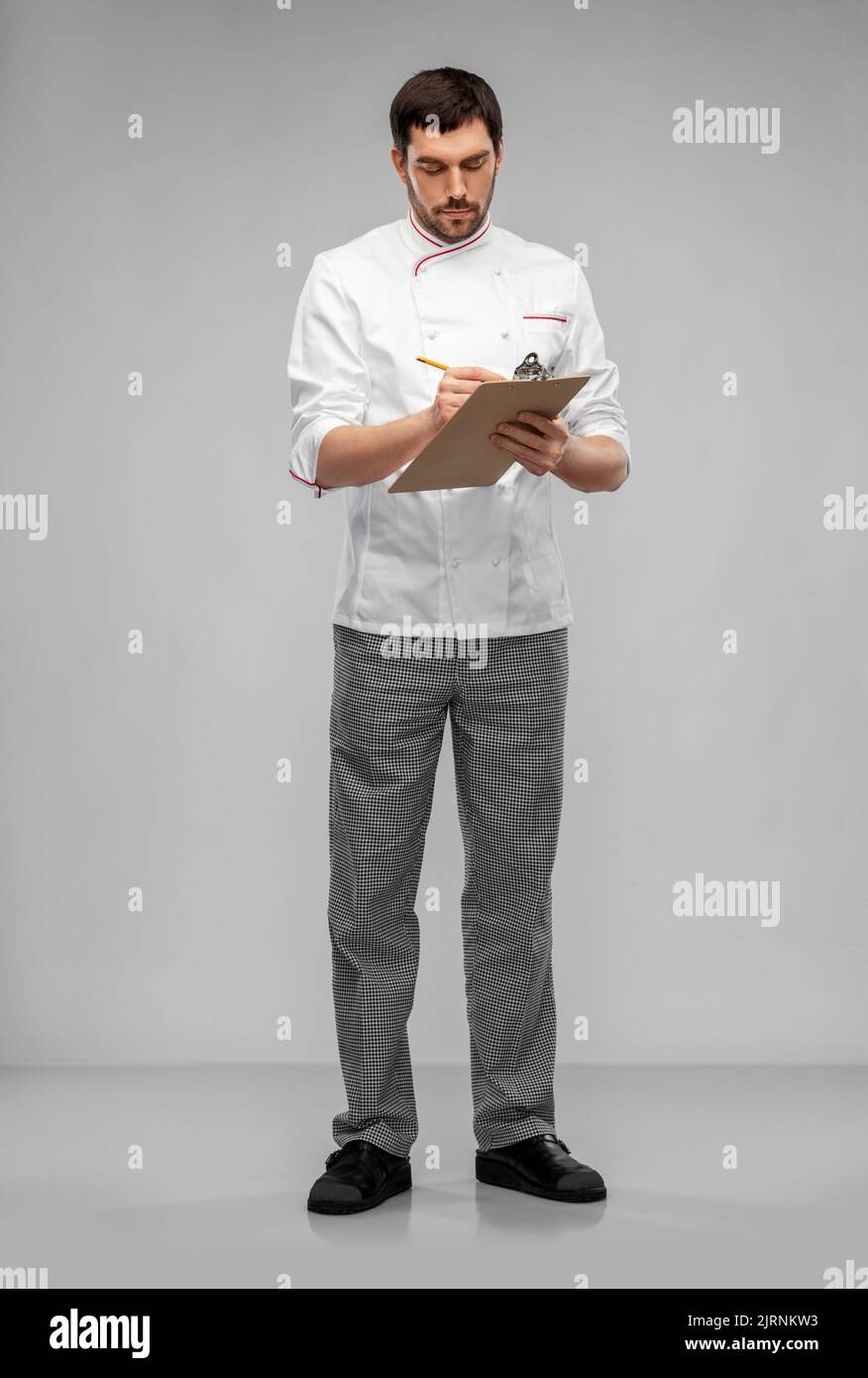 male chef with clipboard and pencil Stock Photo - Alamy