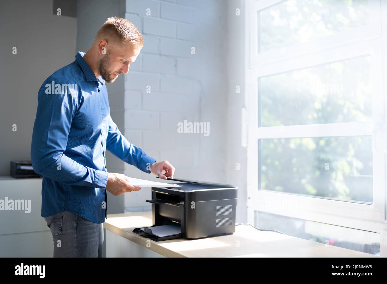 Midsection Side View Of Businessman Pressing Printer's Button In Office ...