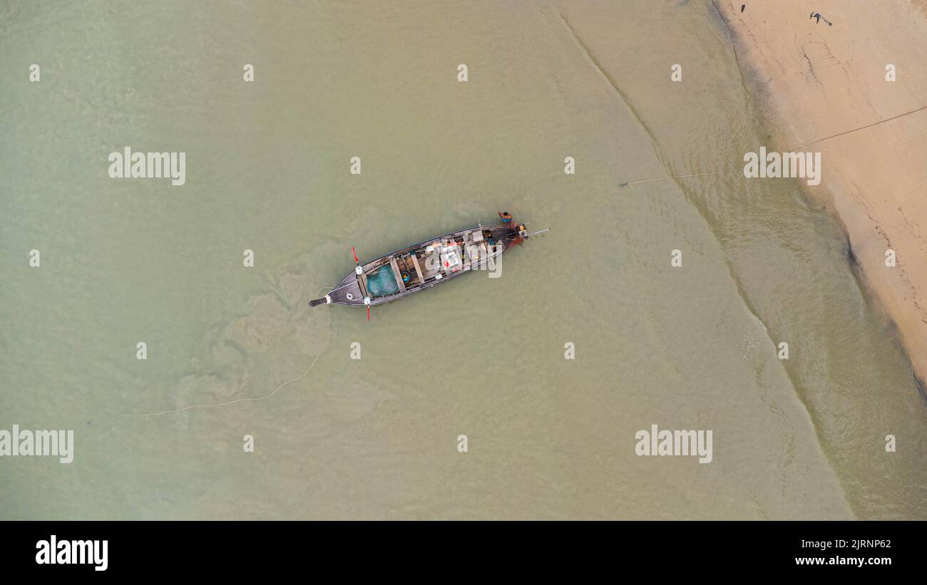 Aerial view from drones of fishing boats in the shore during low tide ...