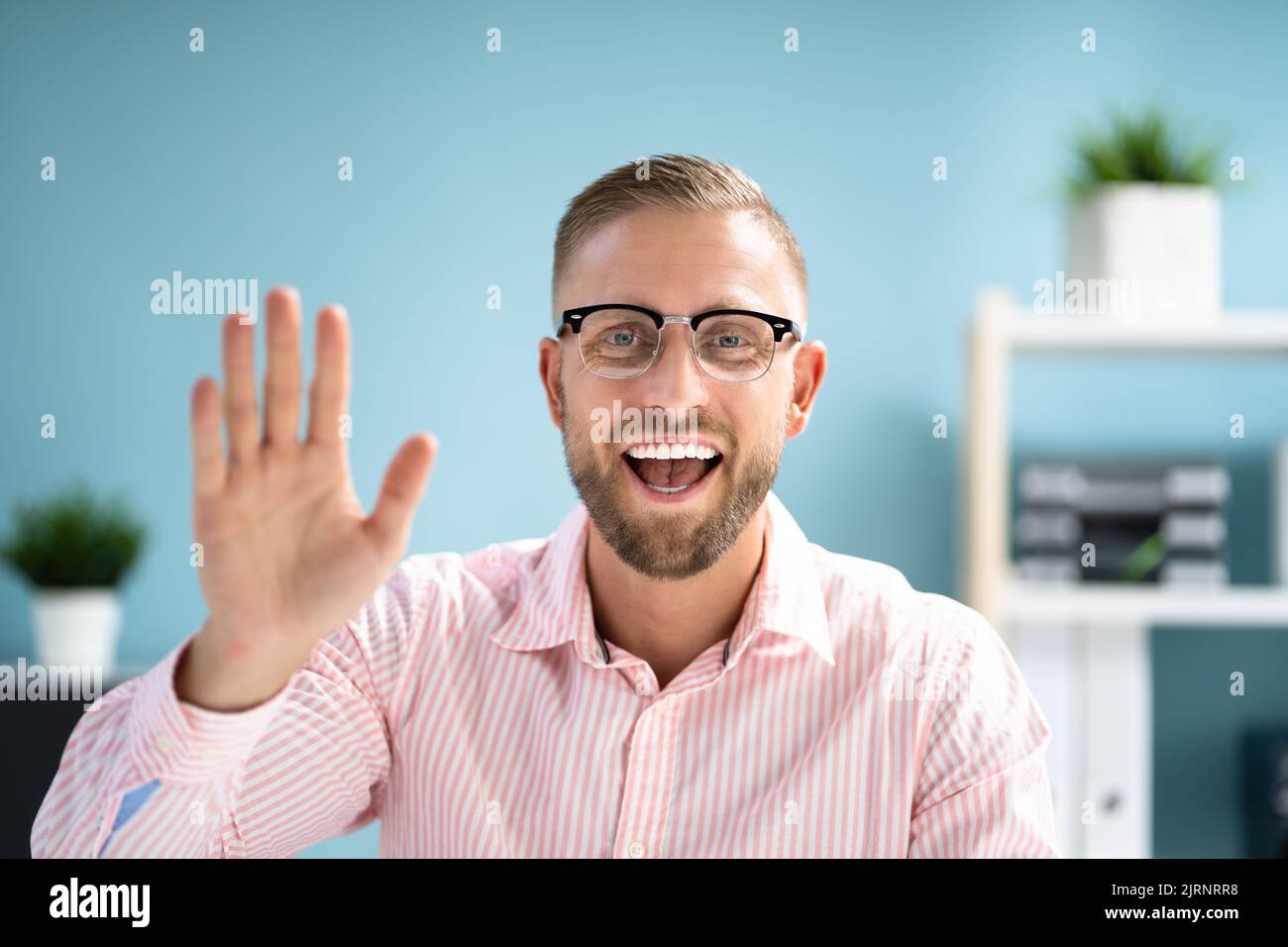 Business man waving greeting hi-res stock photography and images - Alamy