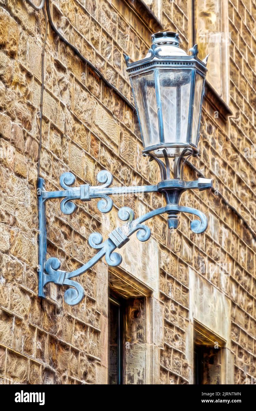 Medieval style street lamp in a stone wall Stock Photo - Alamy