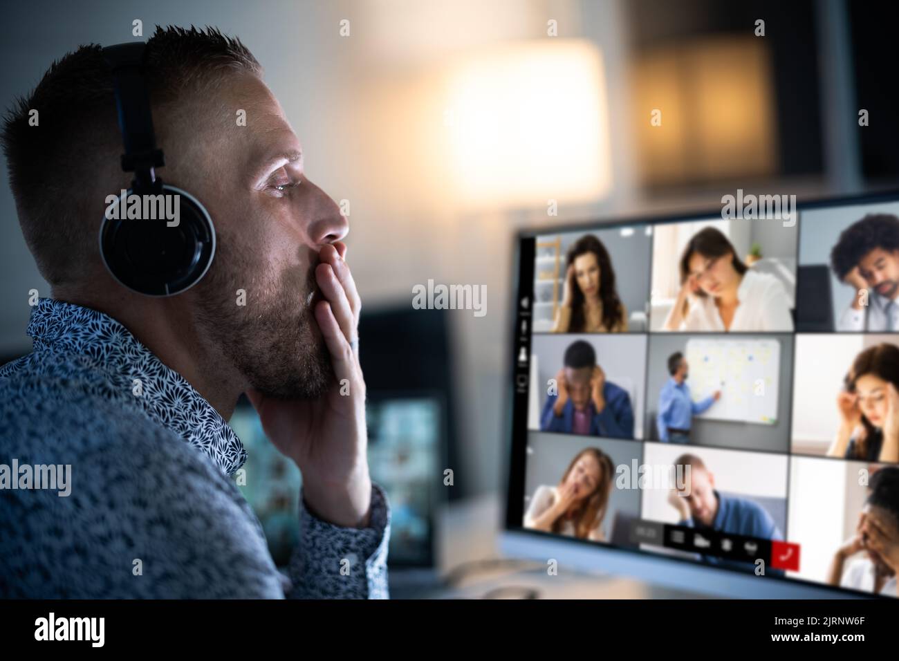 Bored Employee In Video Conference Training Meeting Stock Photo - Alamy