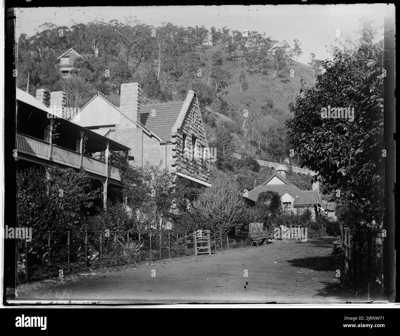 Semi rural street - stone and brick house at centre, by Crombie and ...