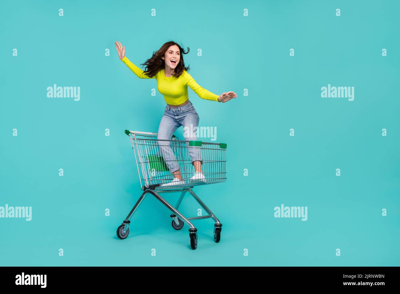 Full body portrait of crazy positive lady stand inside shopping cart ...
