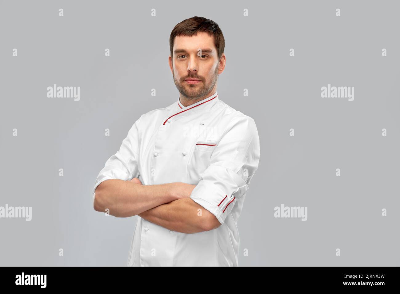 Serious male cook arms crossed hi-res stock photography and images - Alamy