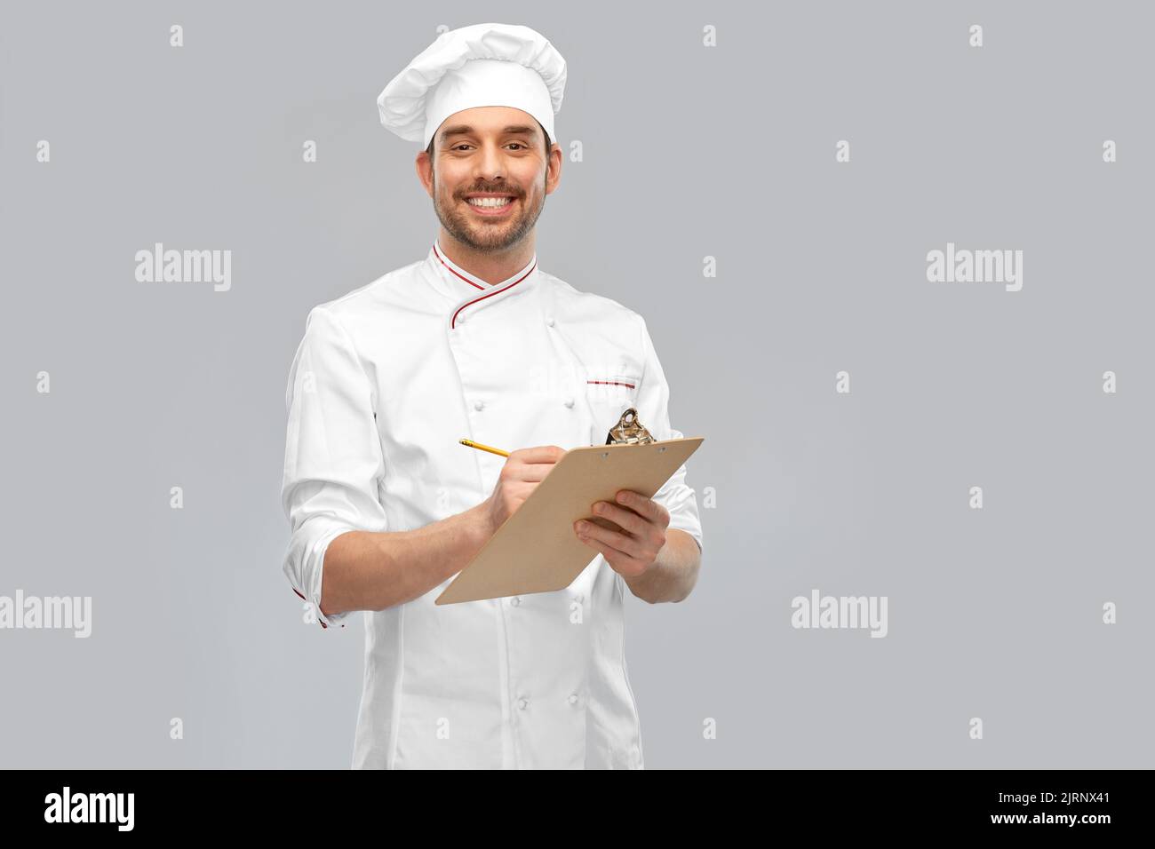 happy smiling male chef with clipboard and pencil Stock Photo - Alamy