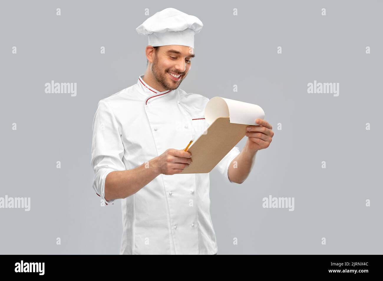 happy smiling male chef with clipboard Stock Photo - Alamy