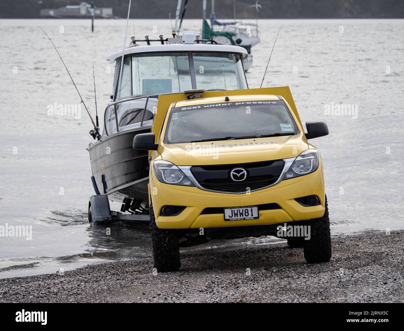 Yellow Mazda BT-50 Generation II (2011-2015) pickup truck pulling Fyran ...