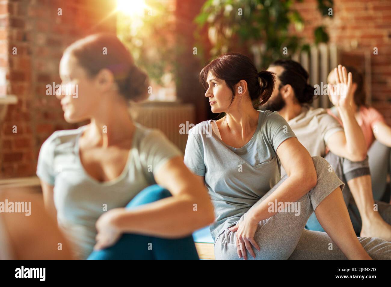 group of people doing yoga exercises at studio Stock Photo - Alamy