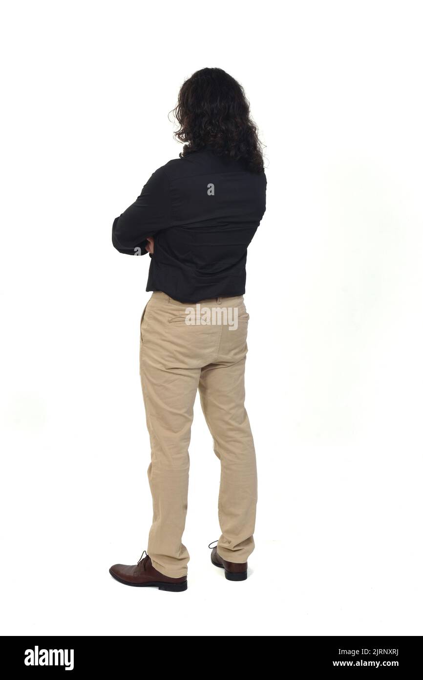 back side view of a man with long hair and arms crossed on white ...