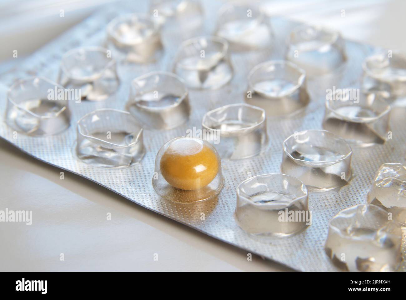 A single tablet left in the blister pack of medication Stock Photo - Alamy
