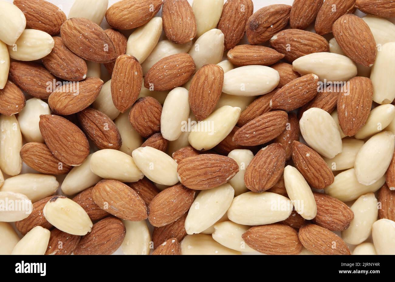 Mixed almonds from above full frame background Stock Photo - Alamy