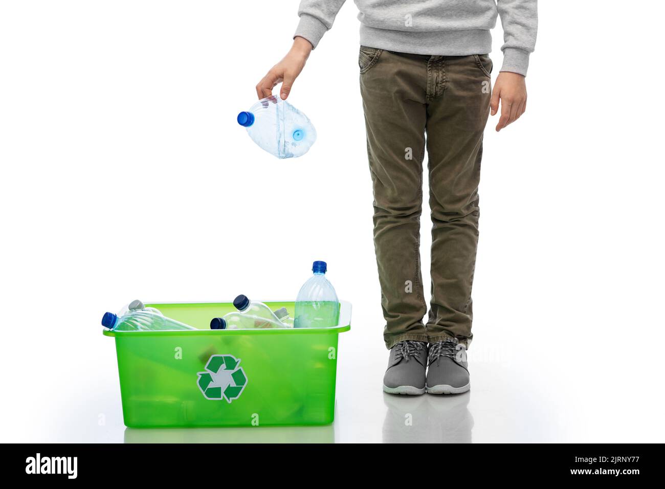 boy throwing plastic bottle into box Stock Photo - Alamy