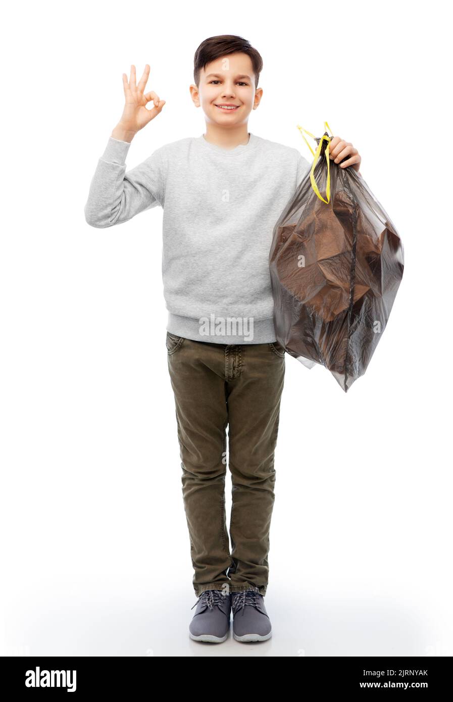 smiling boy with paper garbage in plastic bag Stock Photo - Alamy