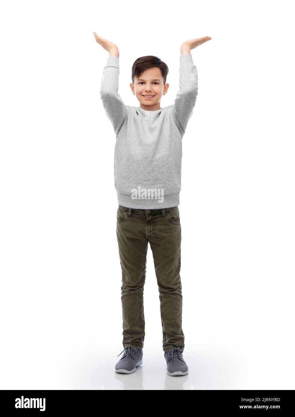 happy smiling boy holding something imaginary Stock Photo - Alamy
