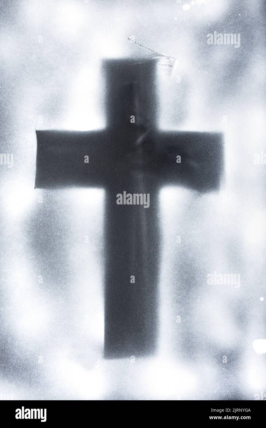 drawing of a cross with spray paint on black paper background Stock ...