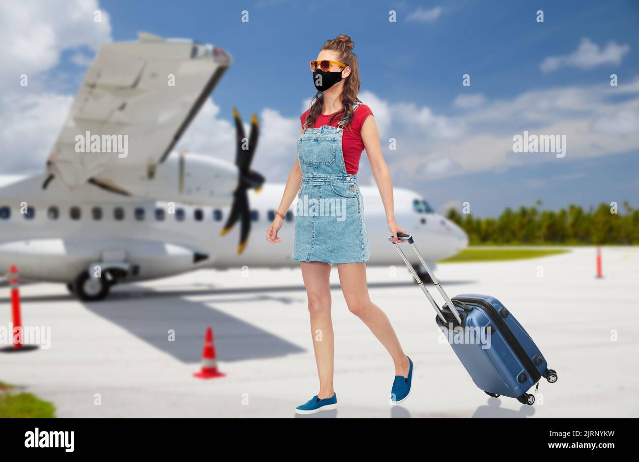 teenage girl in mask and shades with travel bag Stock Photo - Alamy