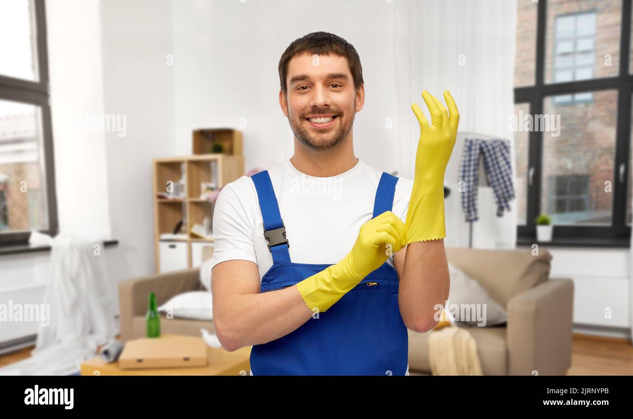 male worker or cleaner wearing gloves at home Stock Photo - Alamy