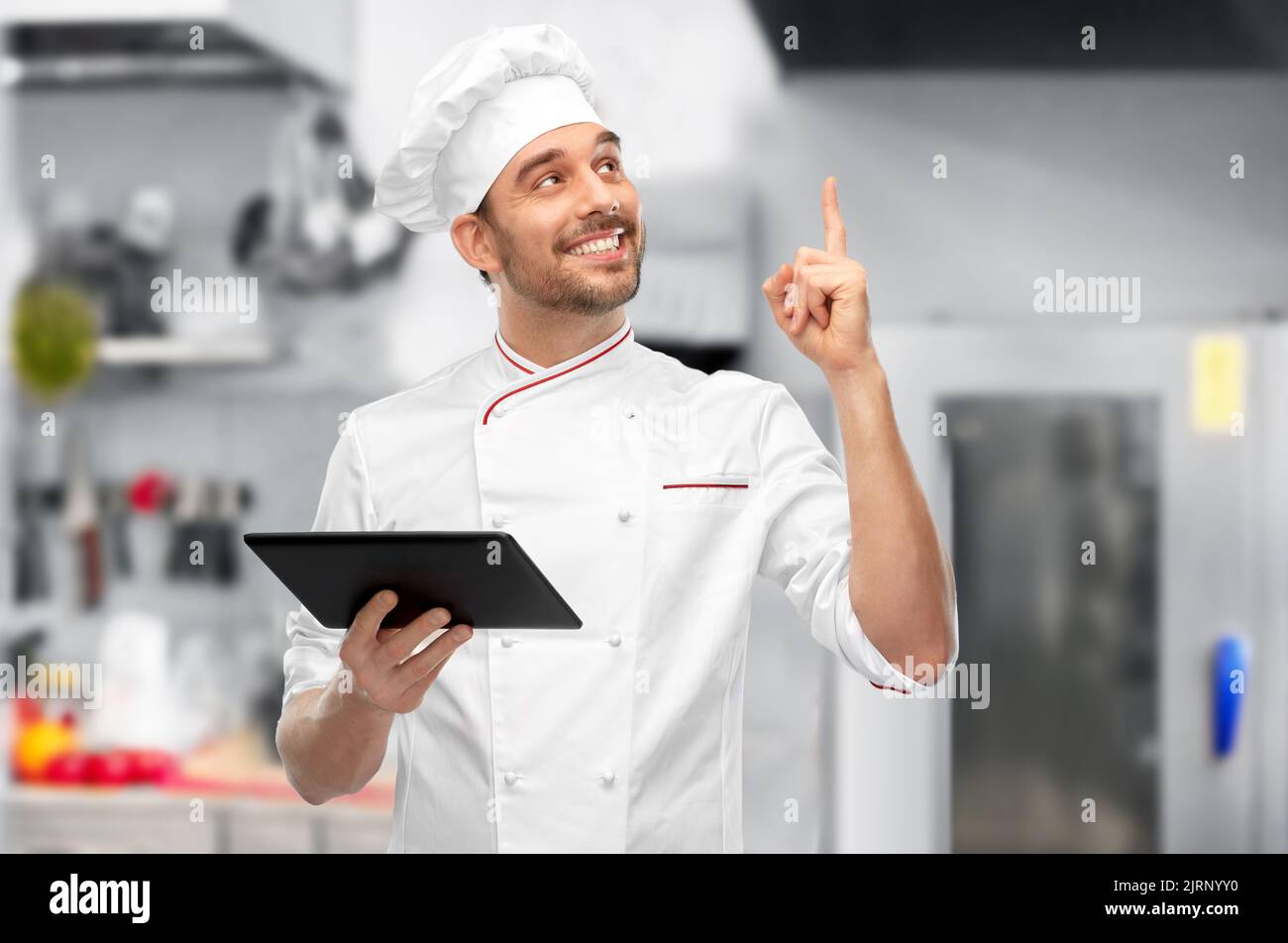 Male restaurant staff showing tablet hi-res stock photography and ...