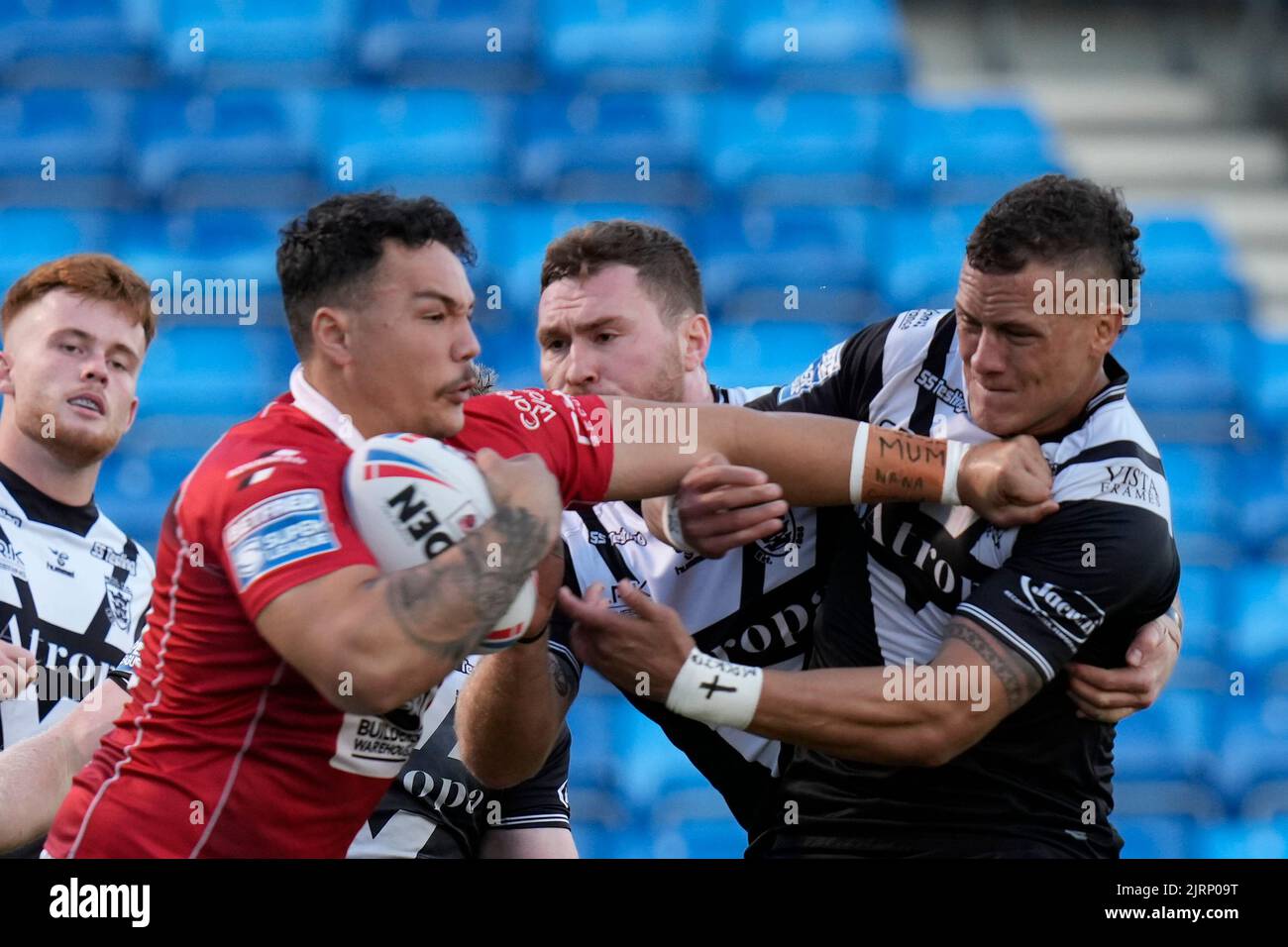Tyler Dupree #32 of Salford Red Devils held by Kane Evans #16 of Hull ...