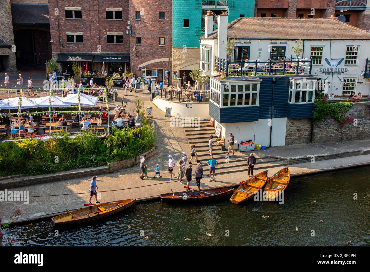 Drinkers enjoy the sunshine at The Boat Club pub in the city of Durham ...