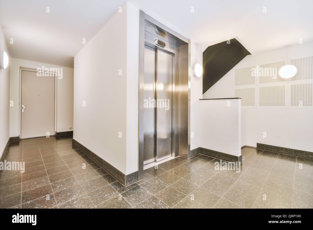 Shiny elevator with opened door located in illuminated hall of ...