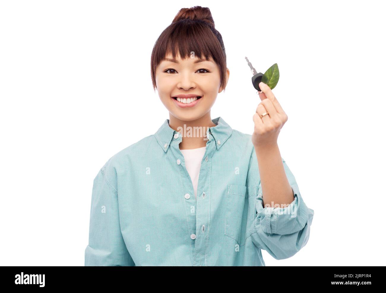 happy asian woman holding car key with green leaf Stock Photo - Alamy