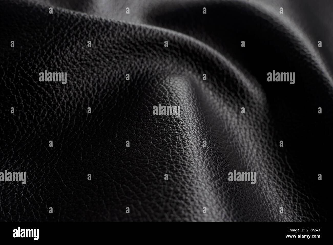 Black leather texture. Abstract background of dark leather with small ...