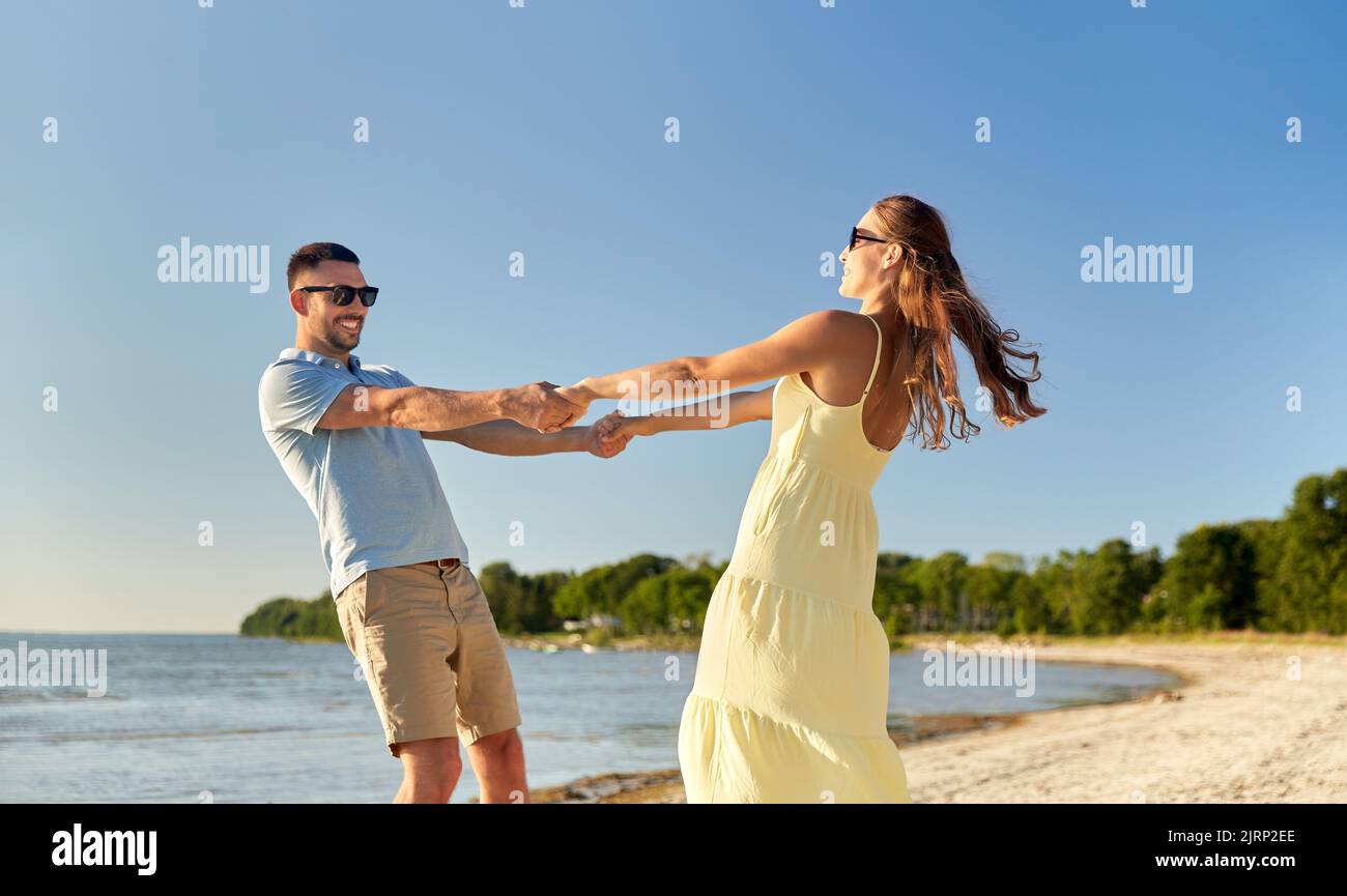 Happy man dancing on beach hi-res stock photography and images - Alamy