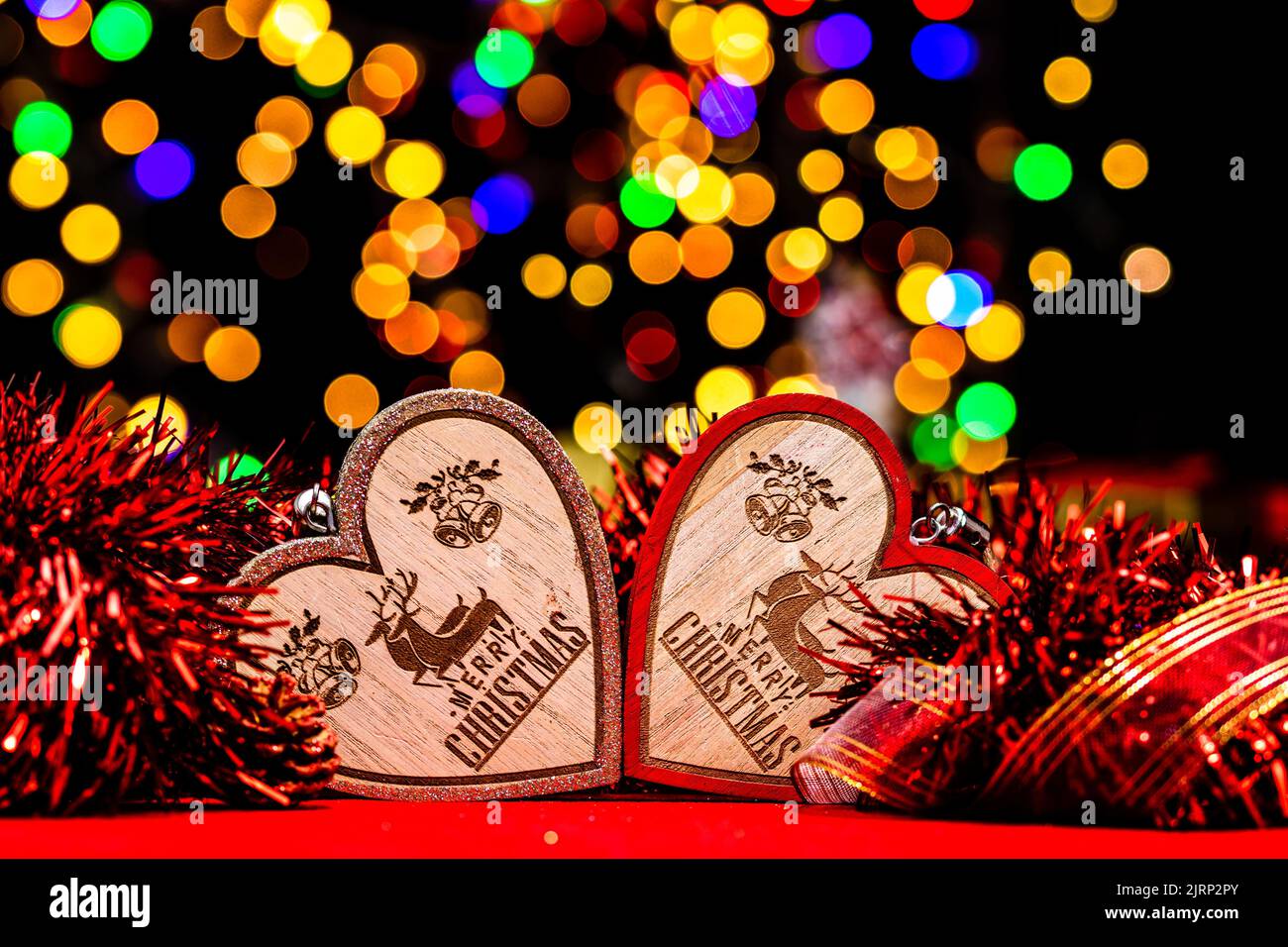 The Christmas heart-shaped decorations and ornaments on a blurred ...