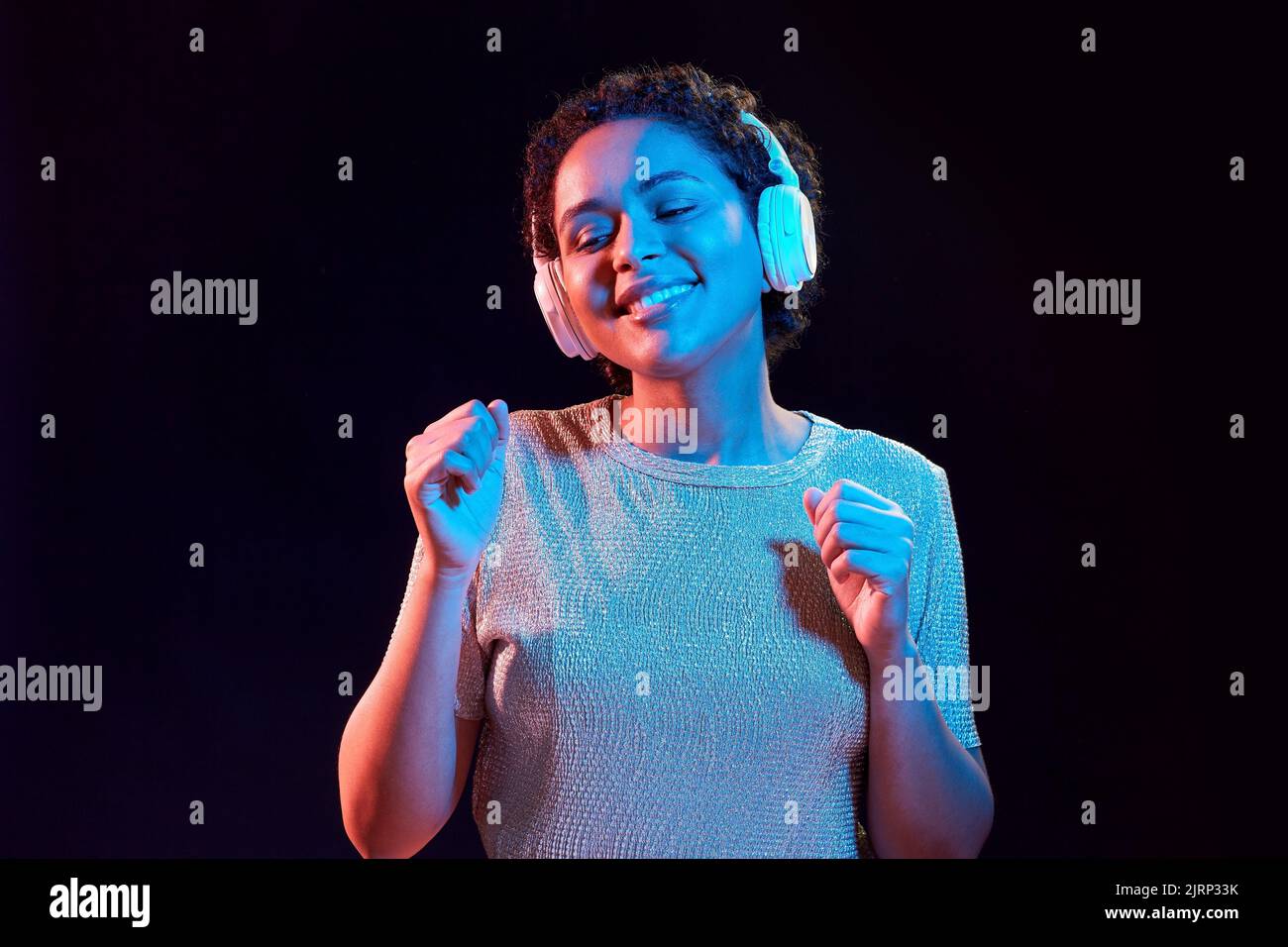 Black woman in headphones dancing hi-res stock photography and images ...