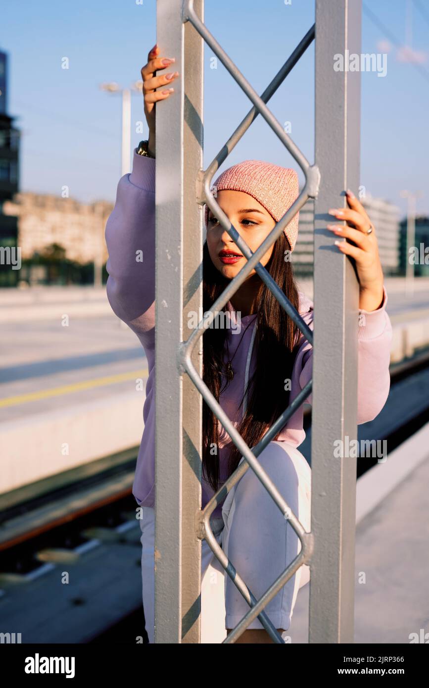 A rebellious girl doing dangerous stuff. A teenage girl climbing on ...