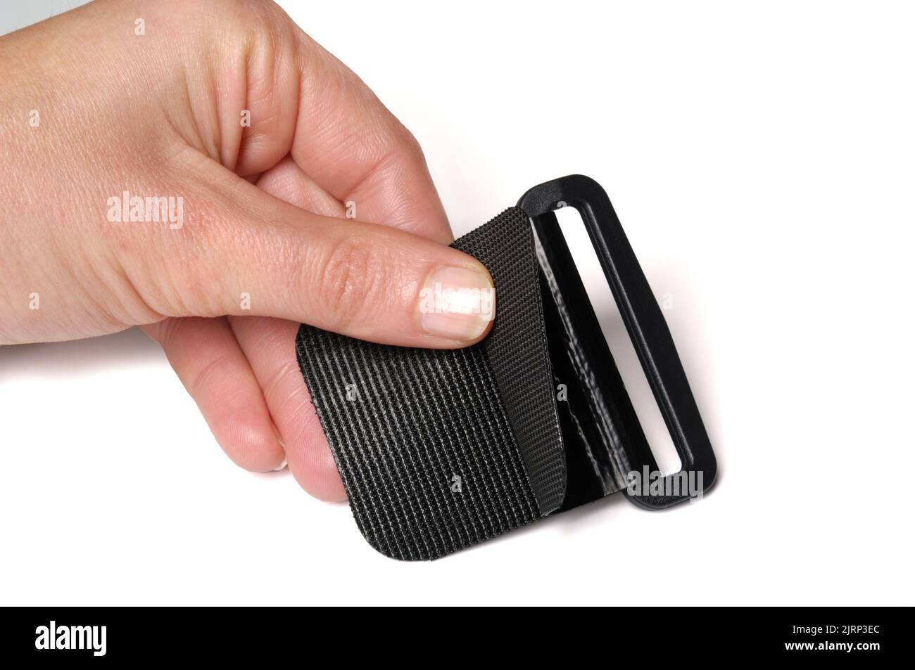 hand holding a buckle on white background Stock Photo - Alamy