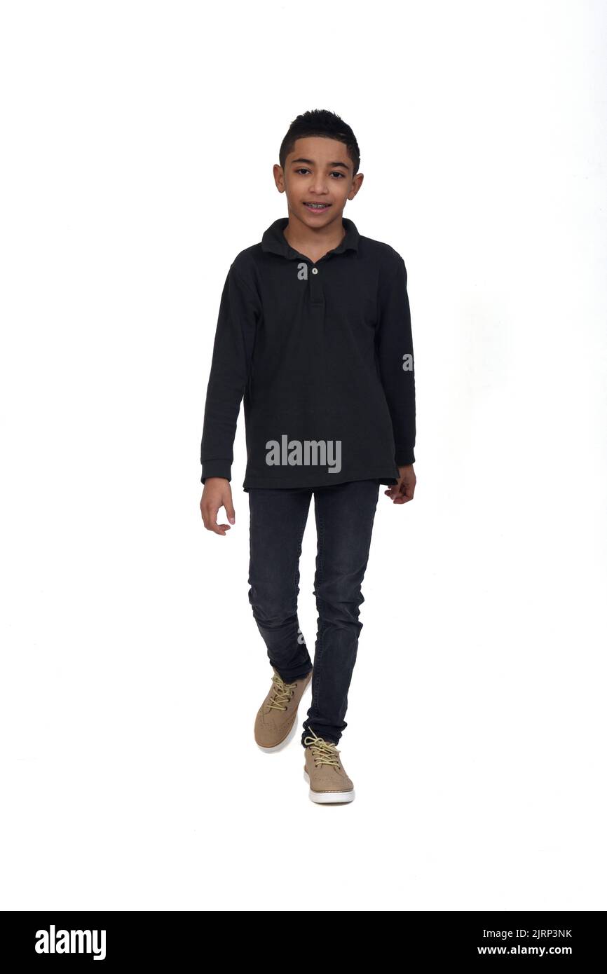 front view of a teen walking on white background Stock Photo - Alamy