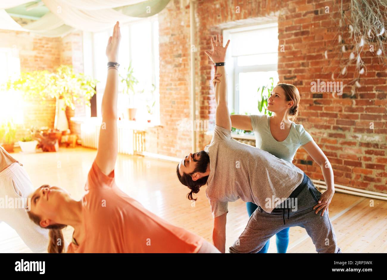group of people doing yoga exercises at studio Stock Photo - Alamy