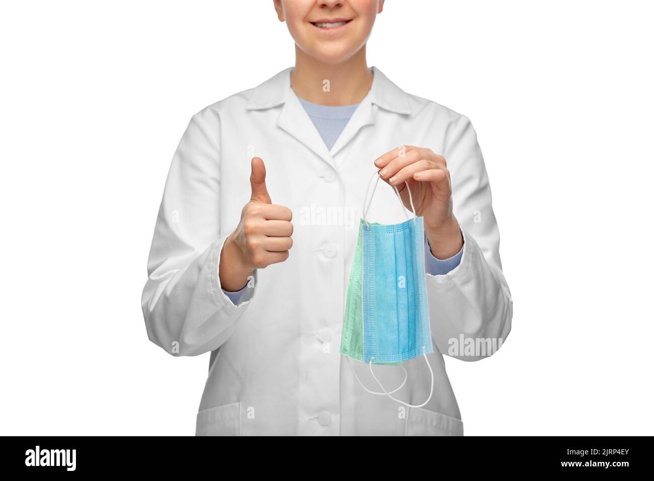 smiling doctor with two masks showing thumbs up Stock Photo - Alamy