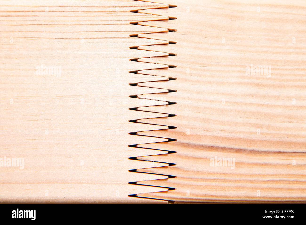 The detail of the toothed connection of two planks. Precise carpenter ...