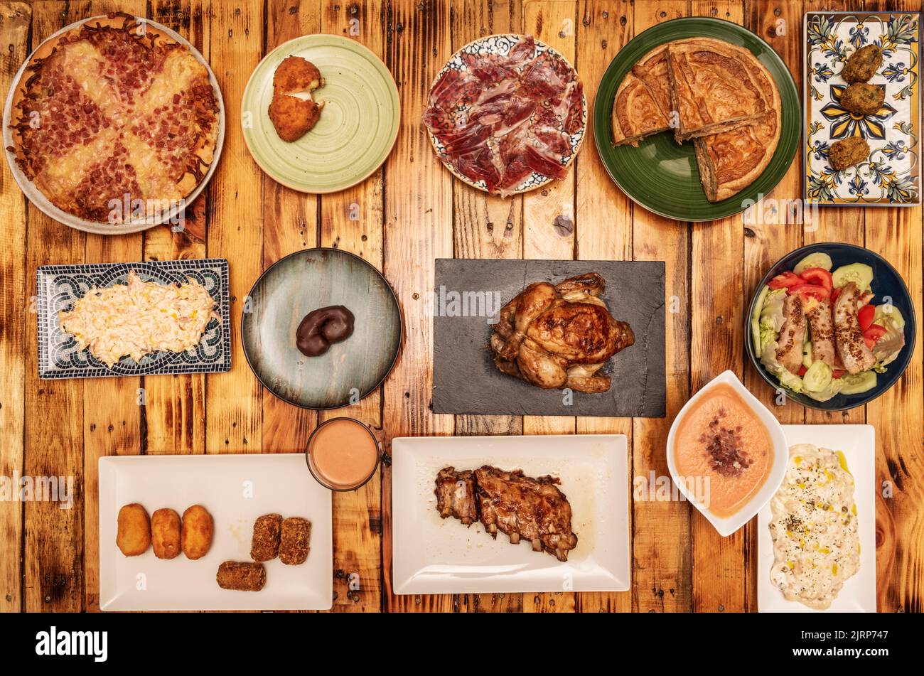 Set of typical Spanish tapas, alioli potatoes, acorn-fed ham tray ...