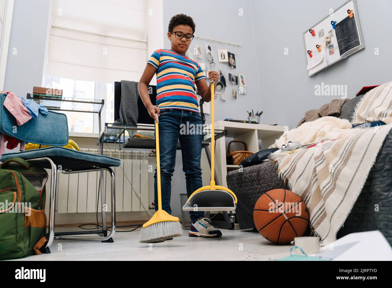 Boy sweeping room hi-res stock photography and images - Alamy