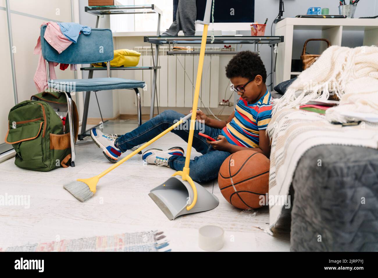 Boy doing housework hi-res stock photography and images - Alamy