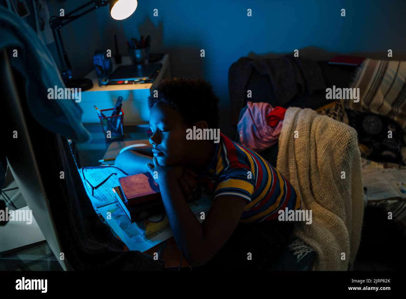 Black boy sleeping by computer monitor during doing at home Stock Photo ...