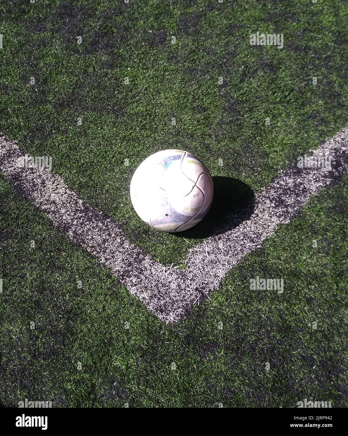 soccer ball in the corner mark on synthetic grass field Stock Photo - Alamy