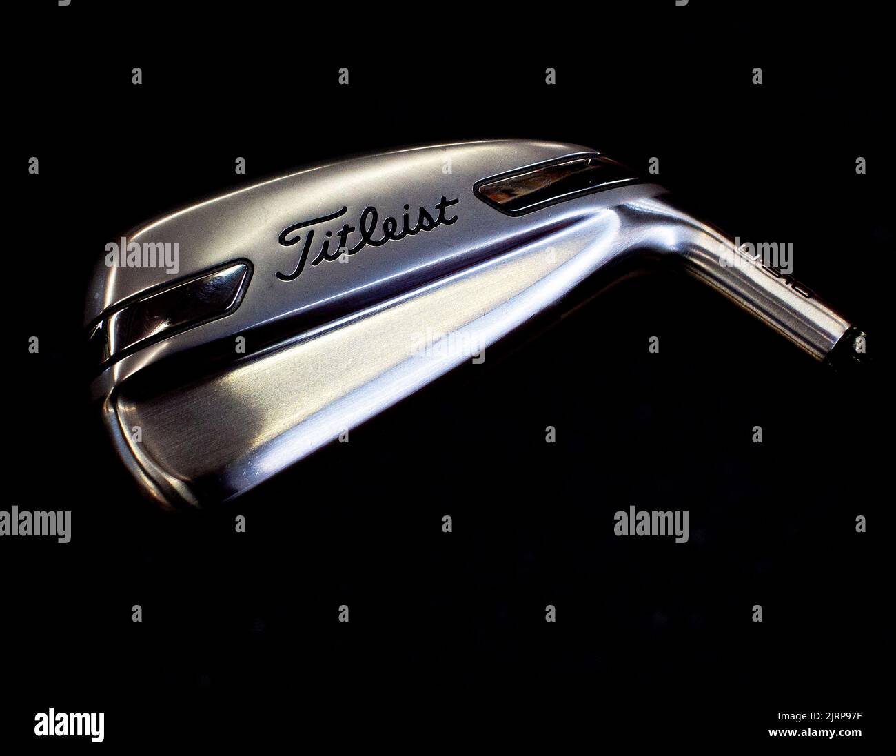 Titleist U5 10 1 iron, or utility iron, shown against a black ...