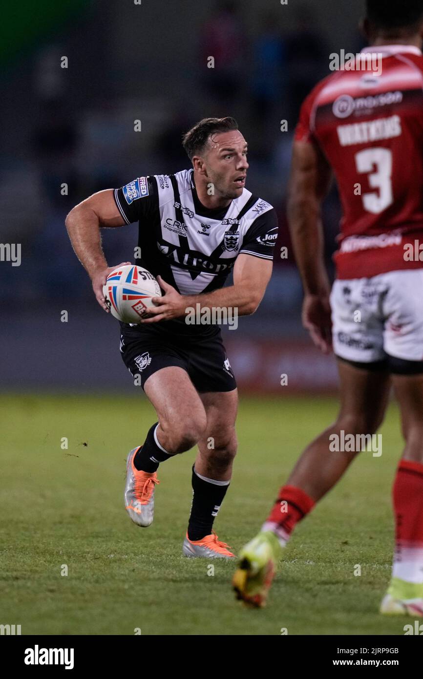 Luke Gale #7 of Hull FC runs at Kallum Watkins #3 of Salford Red Devils ...
