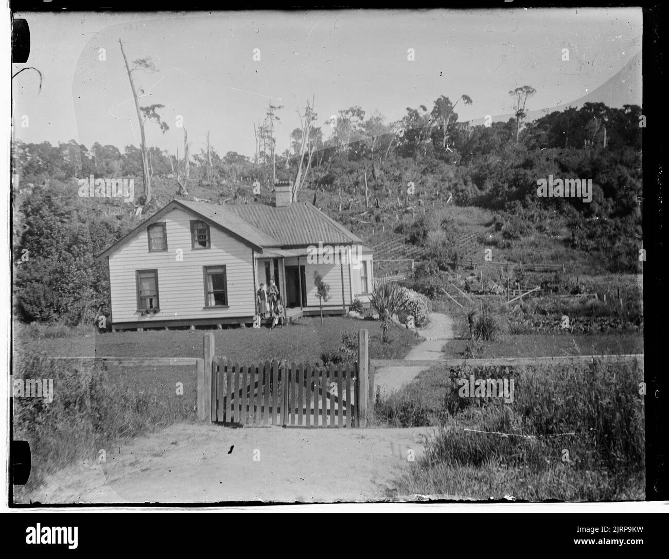 House, with people on porch and surrounding area, by Crombie and Permin ...