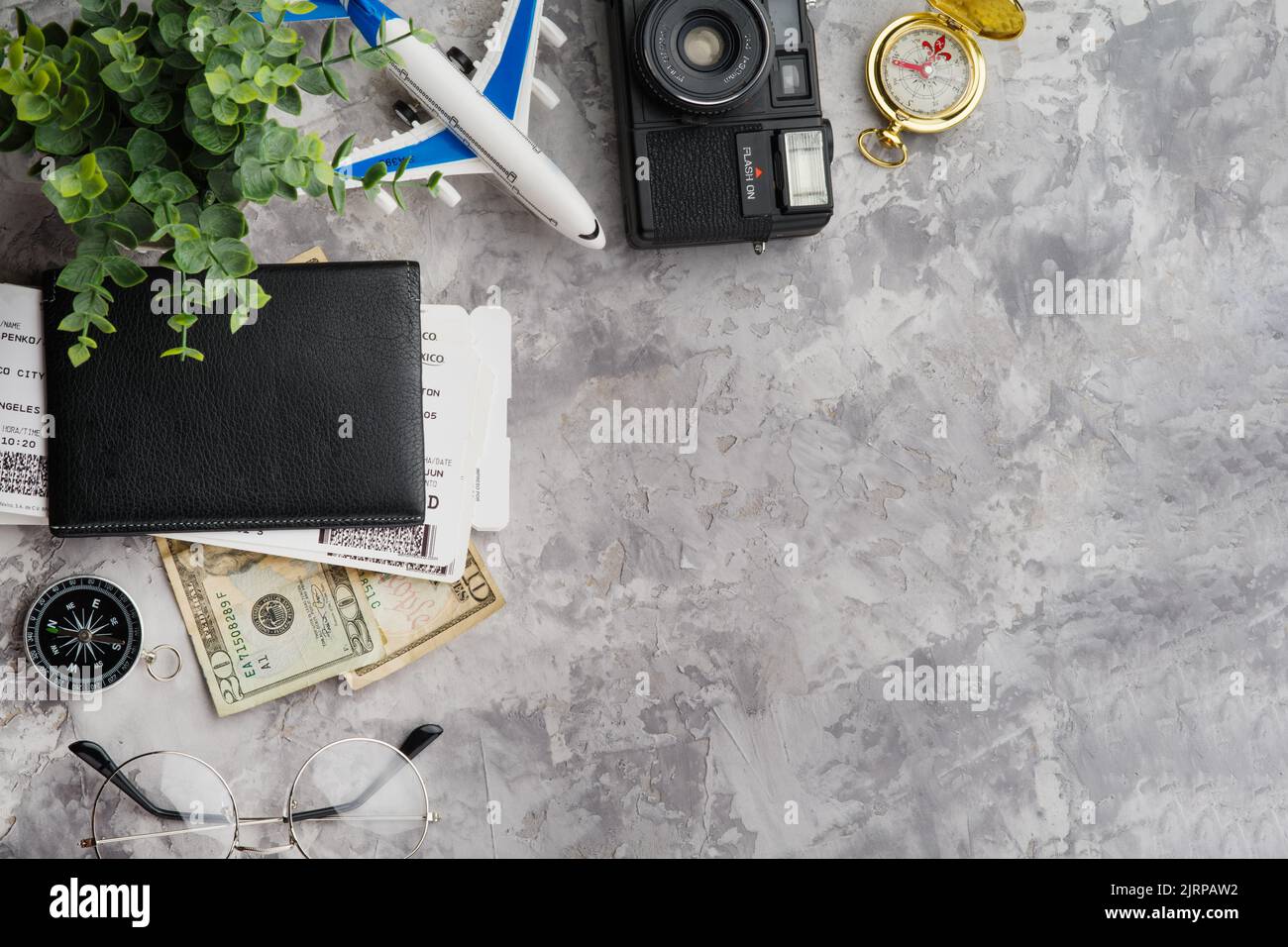 Everything for travel, tourism. On a gray background, money, a passport ...