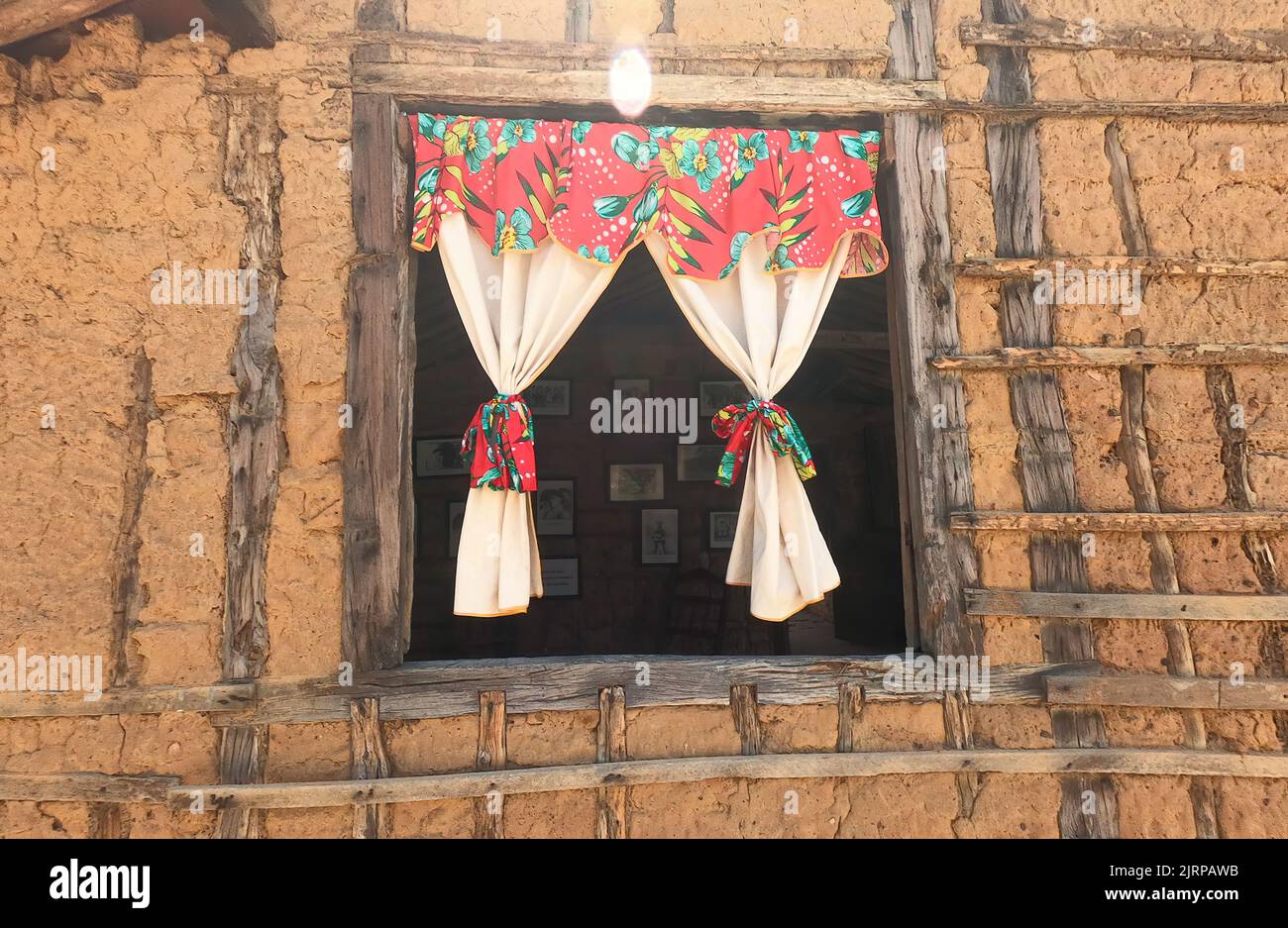 Window with curtains of a mud house, typical of the sertão of ...