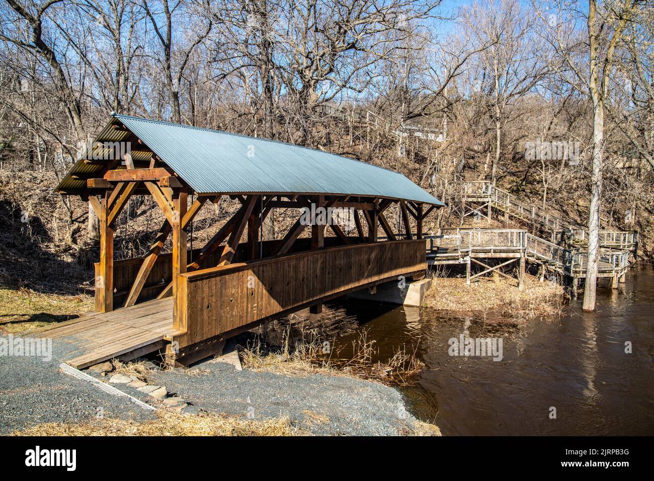 Covered bridge in Taylors Falls, Minnesota USA on the St. Croix River in spring; built in 2007 ...