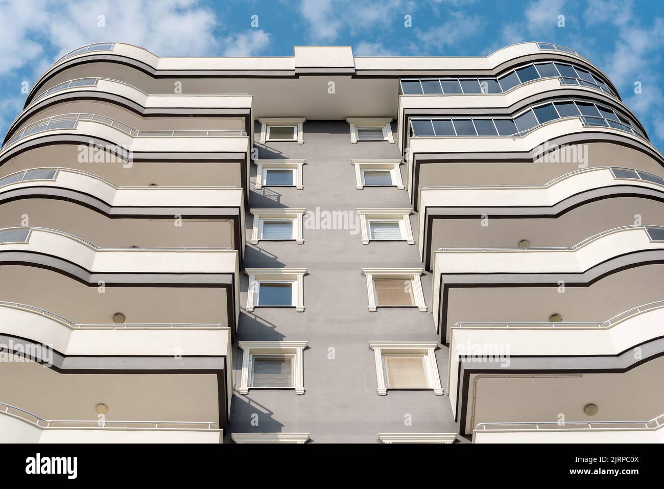 Low angle view of an apartment building with balconies. Residential ...